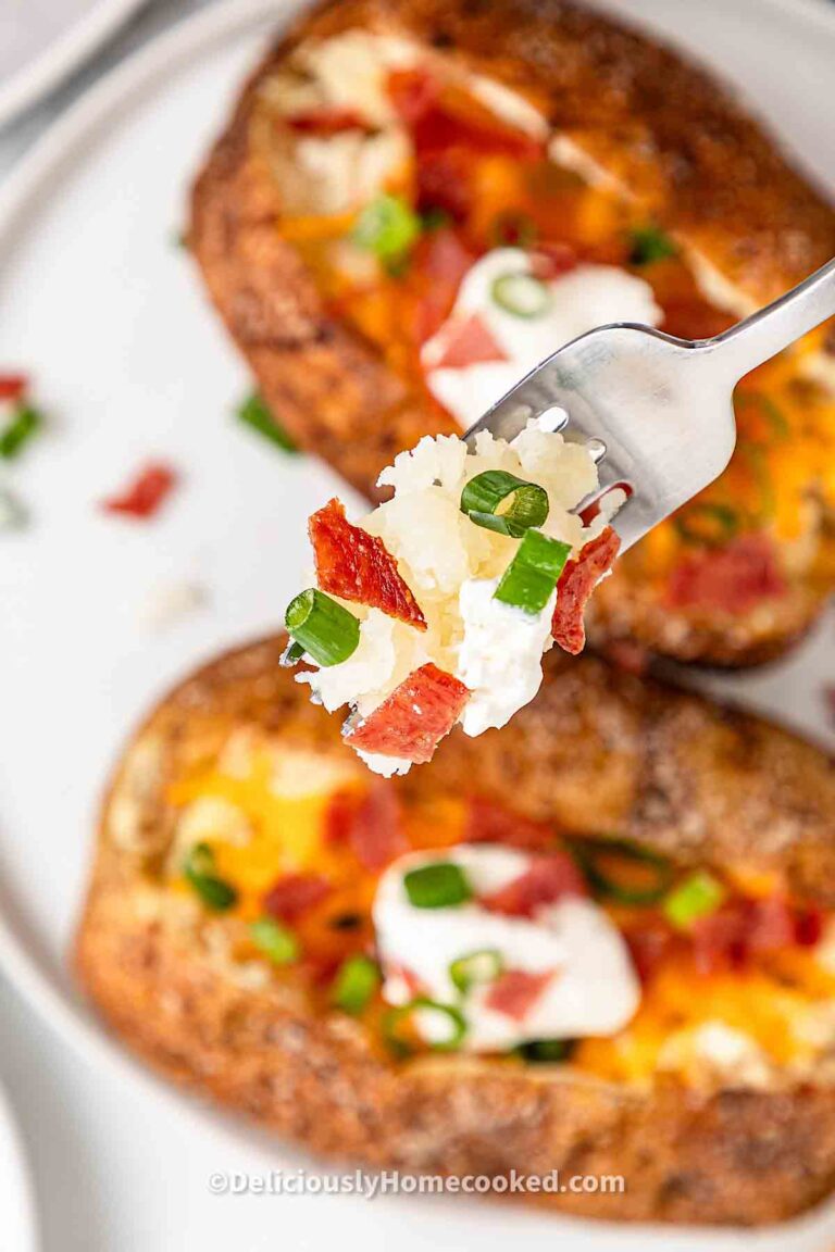Loaded baked potatoes with bacon and cheese - Deliciously Home Cooked